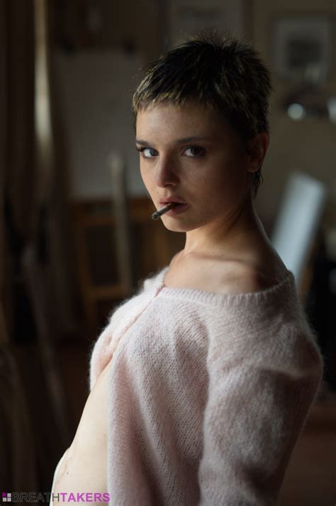 Thin Girl With Short Hair Caterina Foxy Smokes While Topless In Her