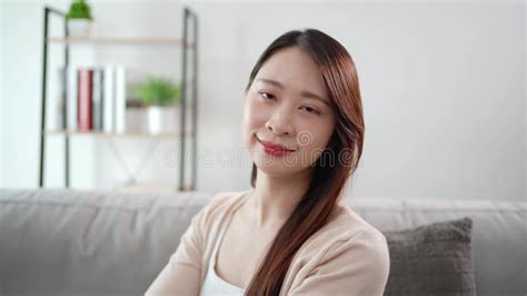 A Portrait Beautiful Asian Woman With Long Brown Hair Is Sitting On A