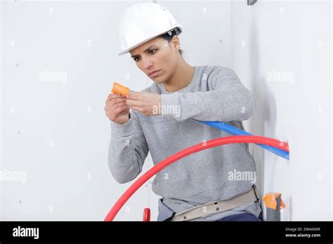 Female Electrician Installing A Wall Socket Stock Photo Alamy