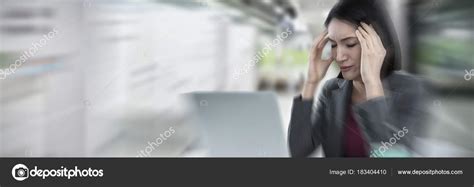 Businesswoman Laptop Suffering Headache Digital Image Corridor Modern Office Stock Photo