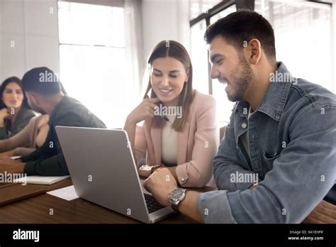Collaborative Workflow Session Between Two Multiethnic Colleagues Using