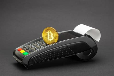 Premium Photo Payment For Purchases With Cryptocurrency Terminal For Payment And Bitcoin Coin