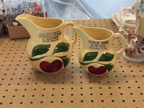 Two Advertising Watt Ware Pitchers From Harlow And Minnewaukan North
