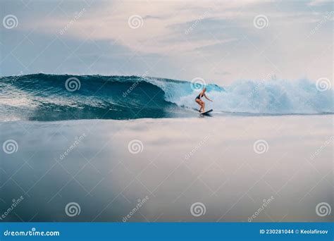 Surfgirl At Surfboard And Perfect Barrel Wave Sporty Woman During