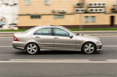 Mercedes Benz C Class W203 Driving On The Street On High Speed Beige Mercedes Benz C Class W203 Driving On The Street On High Speed Beige