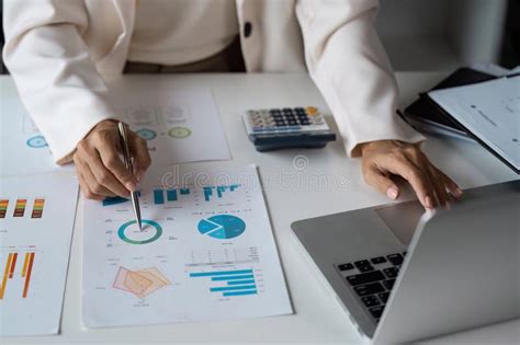 Professional Business Analysis With Graphs And Charts On Office Desk