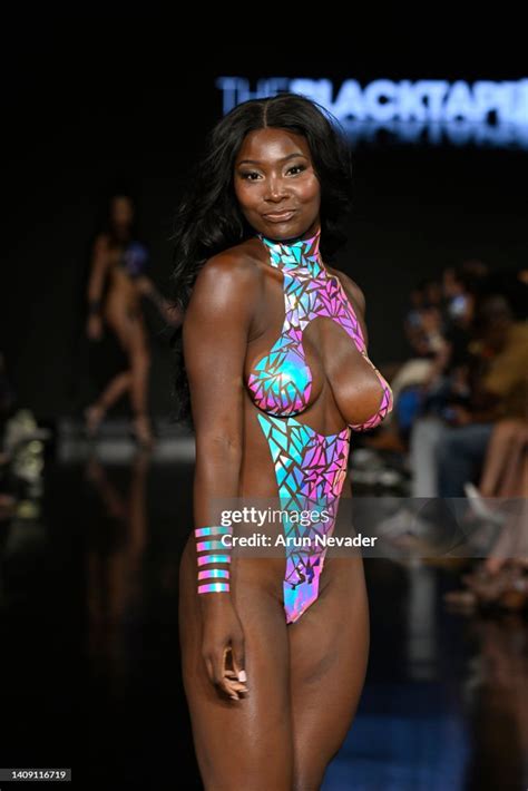 A Model Walks The Runway Wearing Black Tape Project At Miami Swim News Photo Getty Images