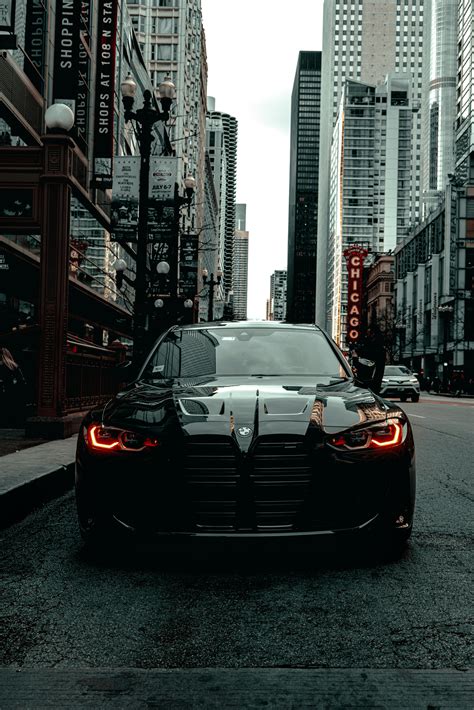 시카고 도시 환경에서 세련된 검은색 자동차 · 무료 스톡 사진