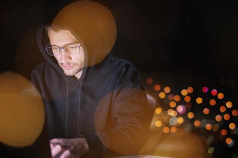 Hacker Using Laptop Computer While Working In Dark Office Stock Photo At Vecteezy