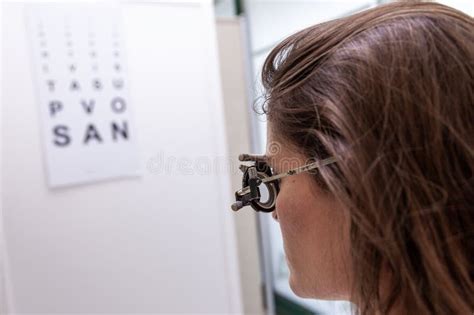 Beautiful Woman Testing New Auxiliary Lenses With Phoropter During An