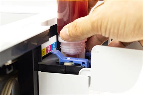 Technicians Are Installing Setup The Ink And Insert Ink Into The Fill Hole Of An Inkjet Printer