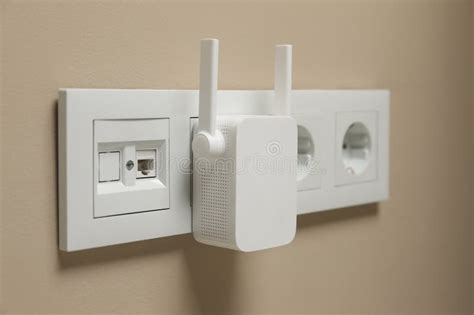 Wireless Wi Fi Repeater In Power Socket On Beige Wall Stock Image Image Of Access Electrical