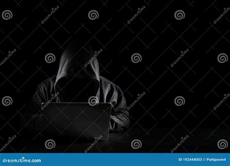 Dangerous Anonymous Hacker Man In Black Hooded Using Computer Breaking