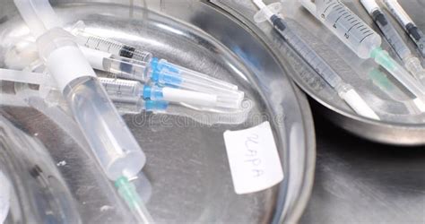 Trays With Medicine In Syringes Stand In A Row On The Table Nurse
