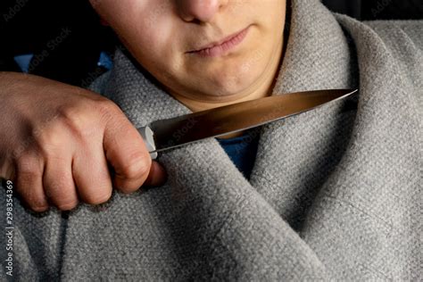 Full Night A Man Holds A Knife At The Girls Throat Close Up Concept