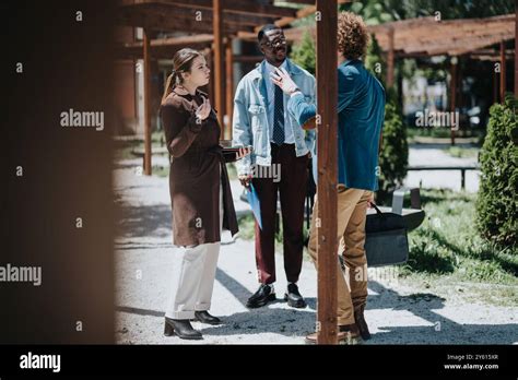 Multicultural Business Team Discussing Project Ideas At An Outdoor