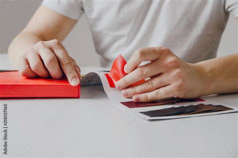 The Man Browses The Color Palette And The Material Template The Concept Of Choosing Colors For