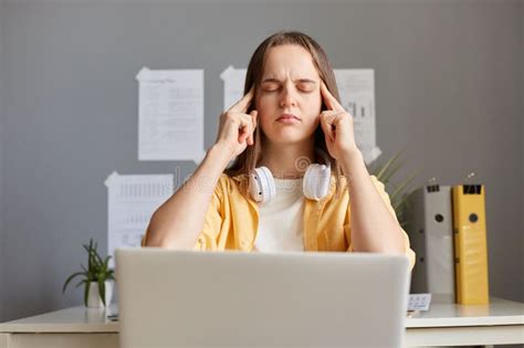 Young Caucasian Woman Stressed And Tired From Work Holding Fingers On