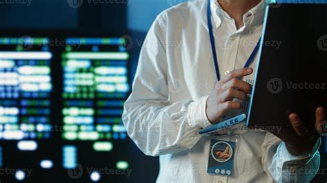 Skillful Admin Strolling Through Server Rows Providing Processing Resources For Different