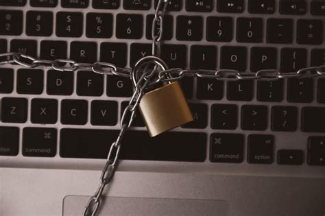 Premium Photo Closeup Of A Keyboard With Chains And A Lock Representing The Concept Of