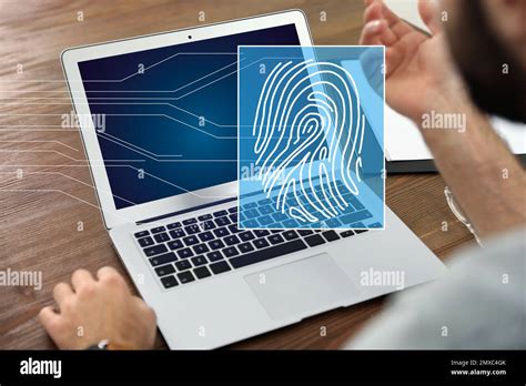 Fingerprint Identification Man Working With Laptop At Table Closeup Stock Photo Alamy