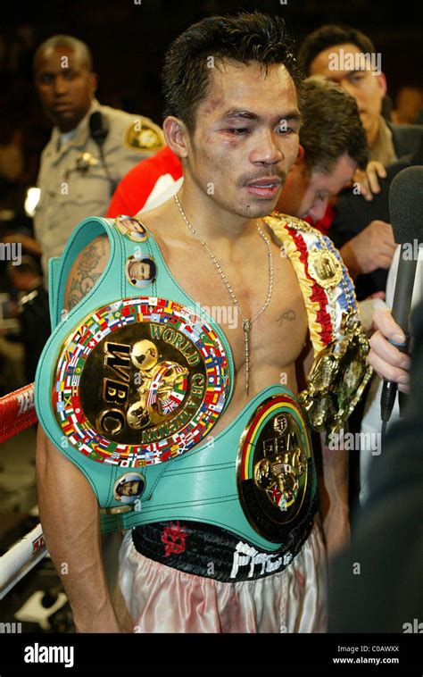 Manny Pacquiao With His Championship Belts Pacquiao Won The Wbc And