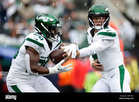 New York Jets Quarterback Zach Wilson 2 Hands The Ball Off To New