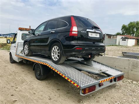 Пътна помощ и транспортни услуги Пътна помощ Пловдив Транспорт на автомобили с платфор