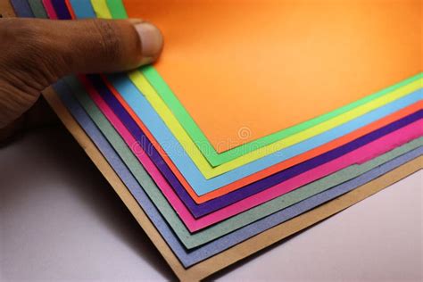 Set Of Different Colored Color Papers Held In Hand Stock Photo Image
