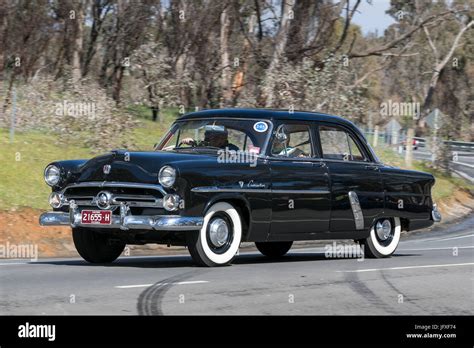 Vintage 1952 Ford Customline Sedan Driving On Country Roads Near The