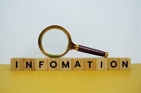 Magnifying Glass With Wooden Blocks Alphabet Letters Infomation Text Message On Yellow