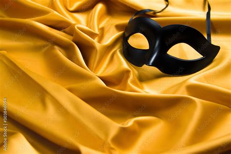 Sexy Black Mask On Yellow Silky Background Stock Photo Adobe Stock