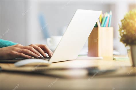 premium photo female hands typing on keyboard