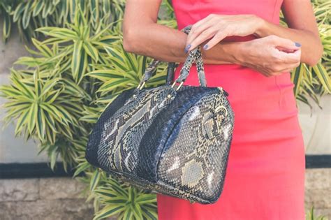 Premium Photo The Girl Is Holding A Bag Made Of Handmade Exotic