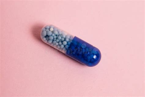 Pill Macro On A Pink Background The Concept Of Improving The Human