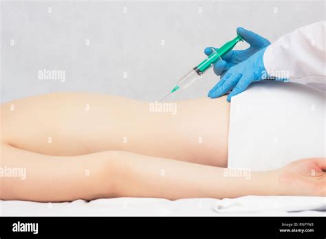 The Doctor Makes An Injection Of Ozone And Chondroprotector In The Spine To The Patient Ozone