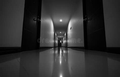 Perspective View Of Hotel Corridor With Ceiling Lamp Light Hallway And Hotel Door Empty