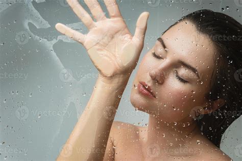 Portrait Of Sensual Woman Captured Through Wet Glass Stock Photo At Vecteezy