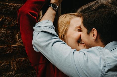 Premium Photo Couple Kissing Against Wall