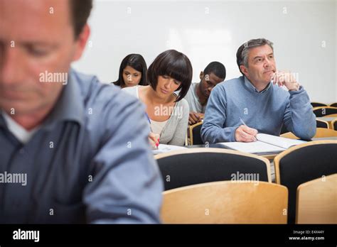 Adult Class Taking Notes Stock Photo Alamy