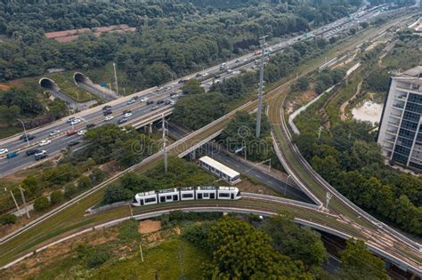 Transportation Hub Covered In Green Trees With Trains Running On Railway Tracks In Wuhan China