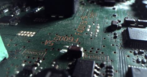 macro camera moving slowly over printed circuit board showing computer