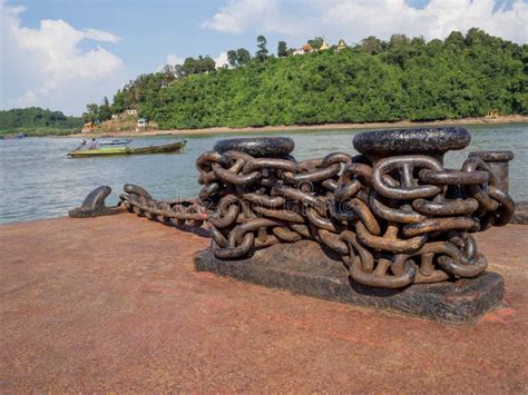 iron chain on a rusted steel raft anchor at port float stock image