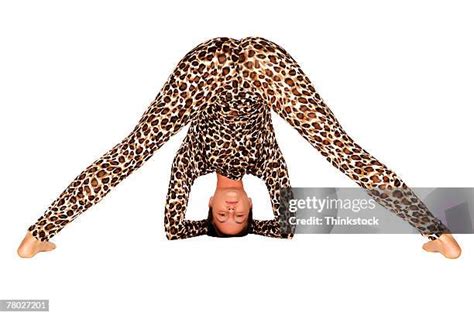 Legs Behind Head Yoga Pose Photos And Premium High Res Pictures Getty