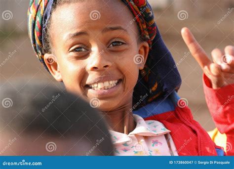 An Eritrean Girl Makes The Sign With Her Index Finger And Looks Towards The Camera On The