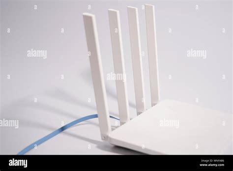 The Back View Of Router Showing The Lan Internet Port And The Land Cable Is Plugging In On A