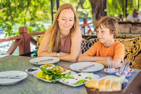 Mom And Son Eat Turkish Breakfast Turkish Breakfast Table Pastries