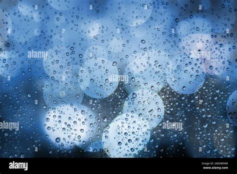 Abstract Background With Raindrops And Soft Blue Bokeh Defocused