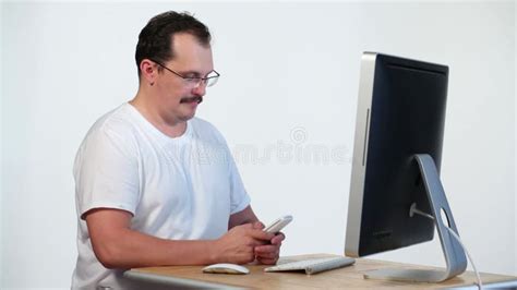 man in white t shirt working on computer and stock footage video of