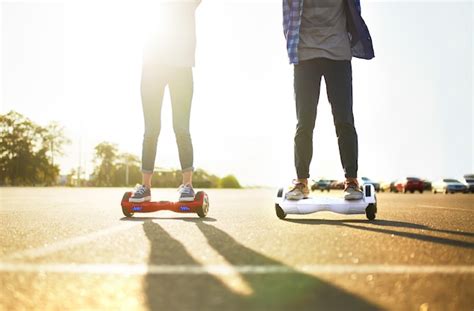 Premium Photo Legs Of Man And Woman Riding On The Hoverboard Together Outdoor Active Lifestyle